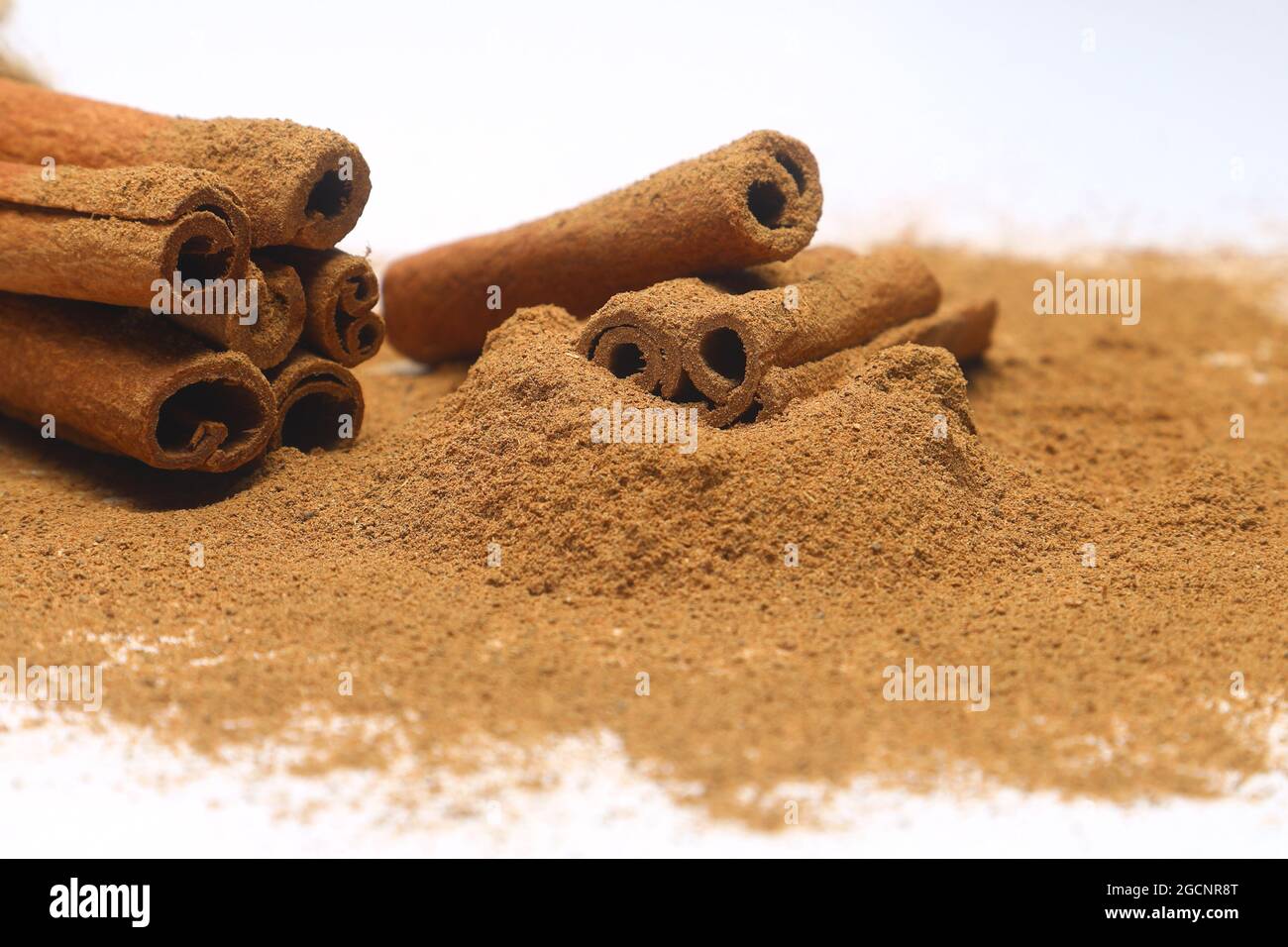Cinnamon sticks and cinnamon powder isolated on white background ...