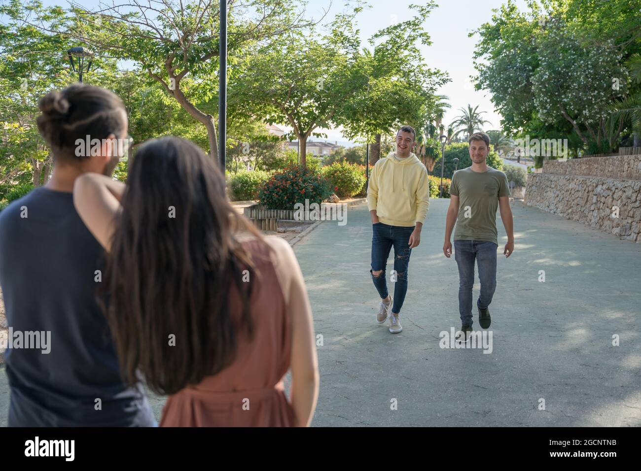 Friends waiting for their friends to arrive. They are arriving. They ...