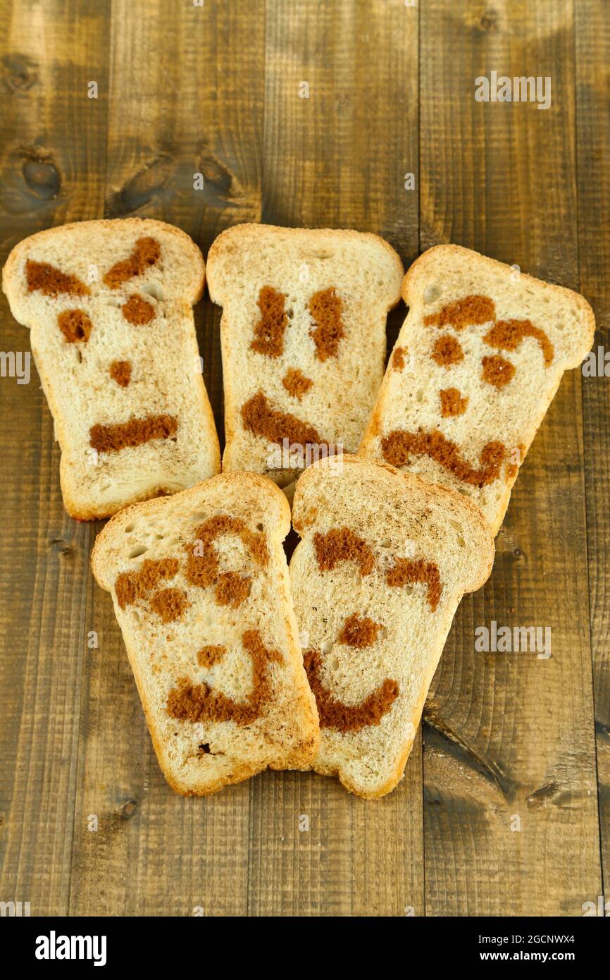 Funny toasts, on wooden background Stock Photo - Alamy