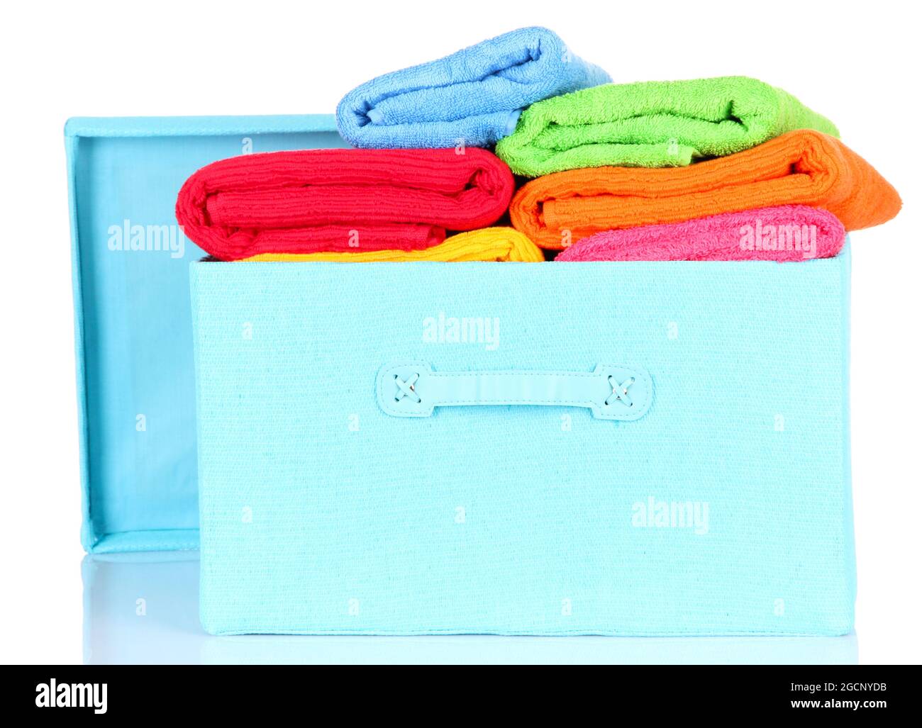 Textile box with bright towels, isolated on white Stock Photo - Alamy