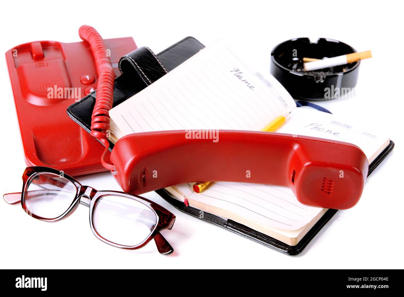 Telephone and notepad and other items, isolated on white Stock Photo ...