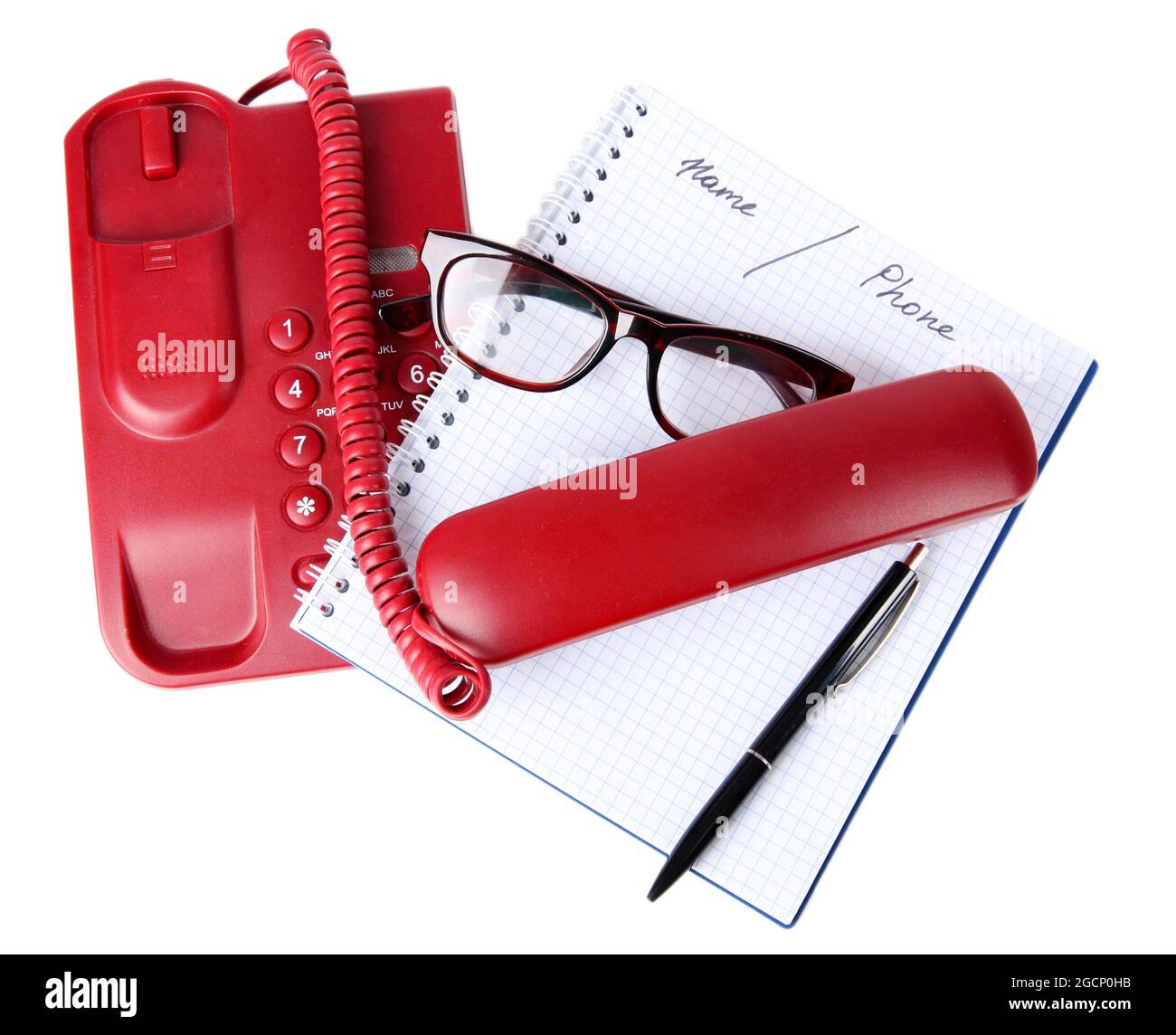 Telephone and notepad and other items, isolated on white Stock Photo ...