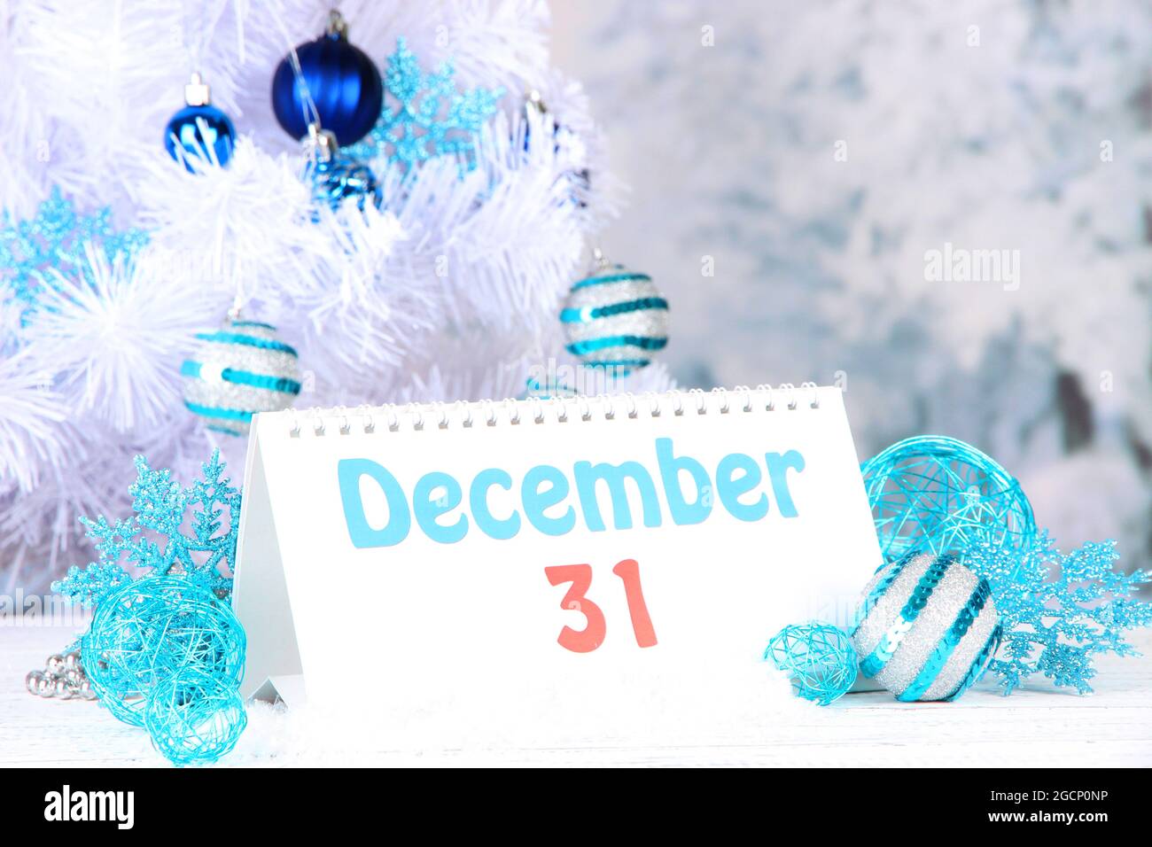 Calendar with New Year decorations on winter background Stock Photo - Alamy