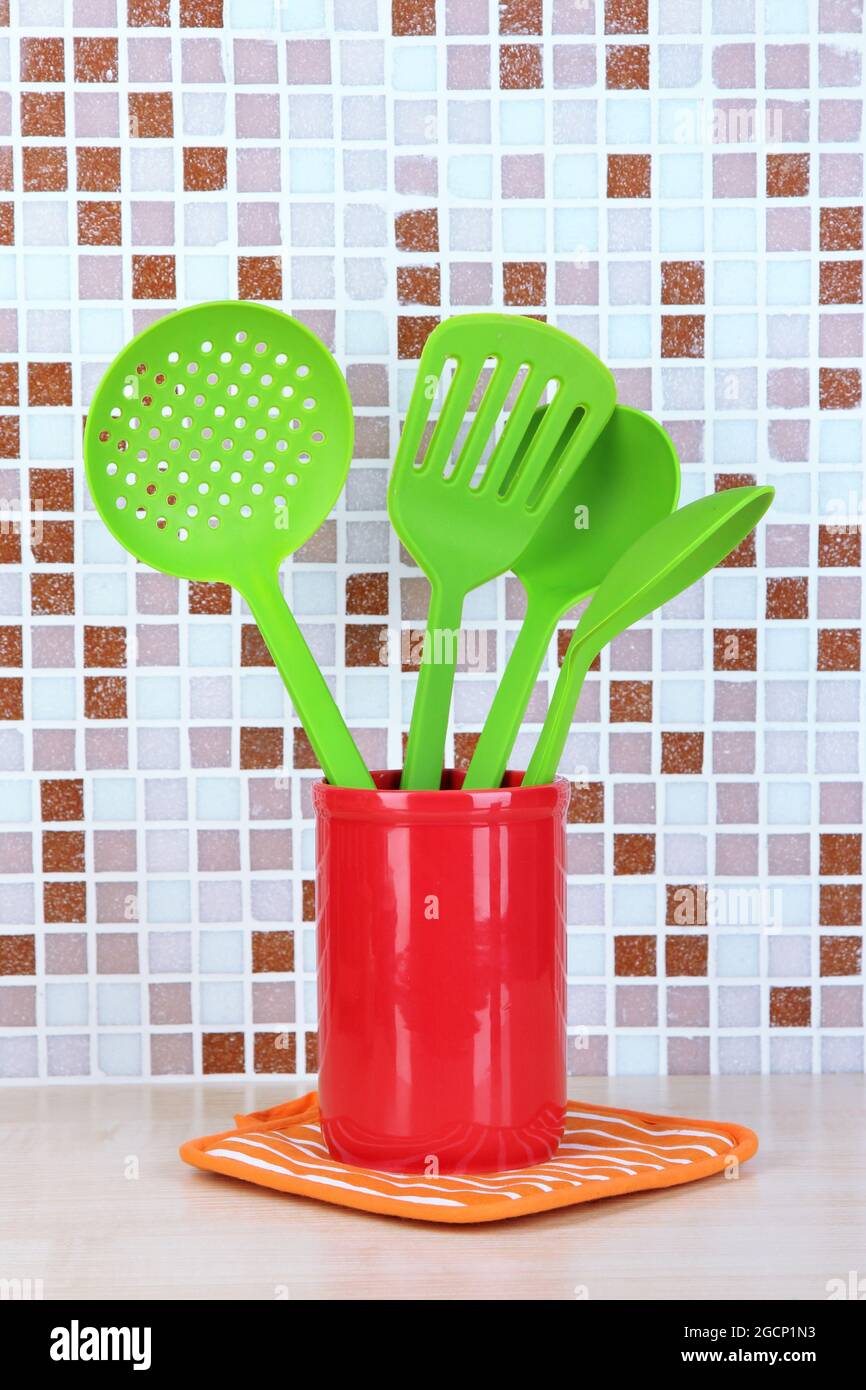 Cooking utensils in kitchen on table on mosaic tiles background Stock ...