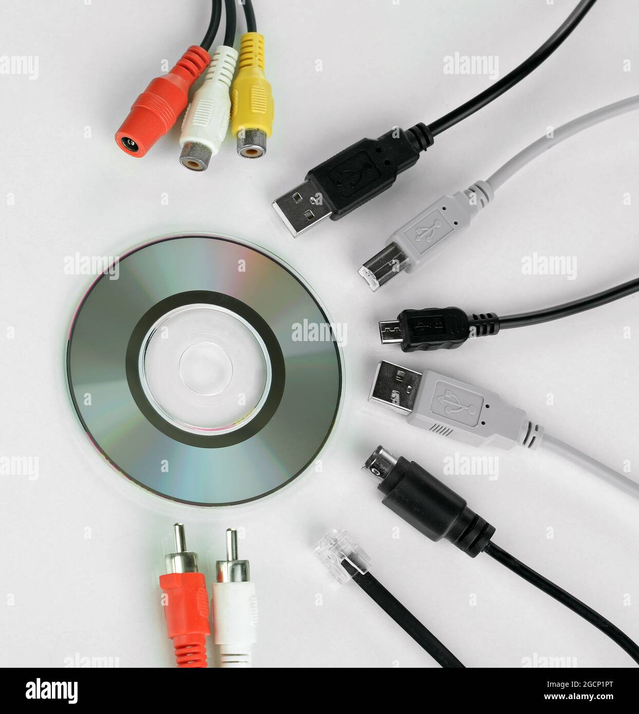Disk and various connector cables isolated on white Stock Photo - Alamy