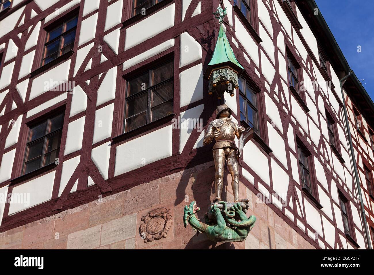 Statue of Saint George in armour on the house corner . Traditional old ...