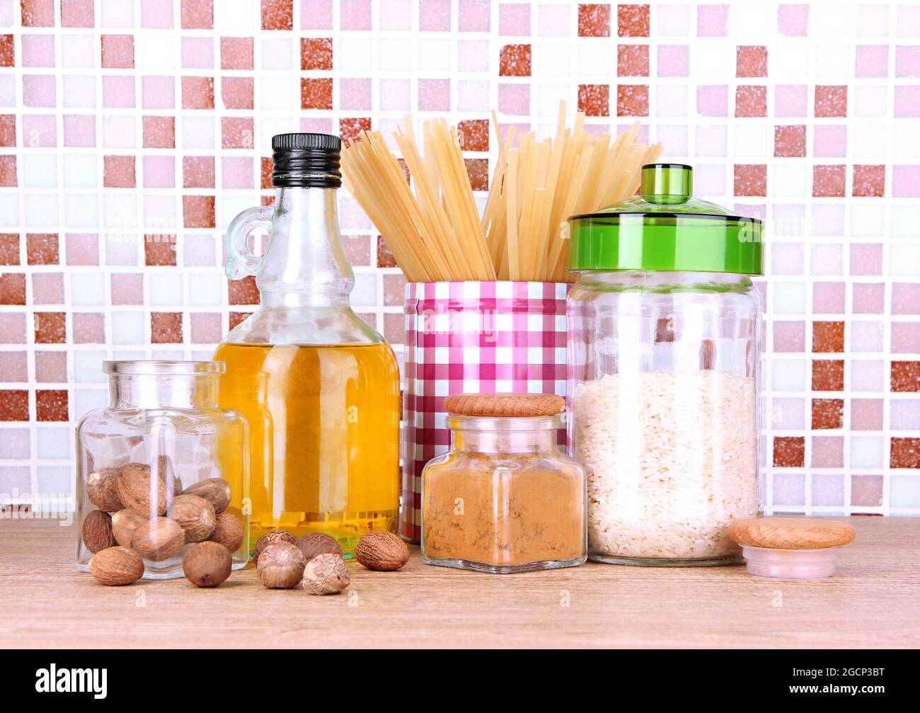 Products for cooking in kitchen on table on mosaic tiles background ...
