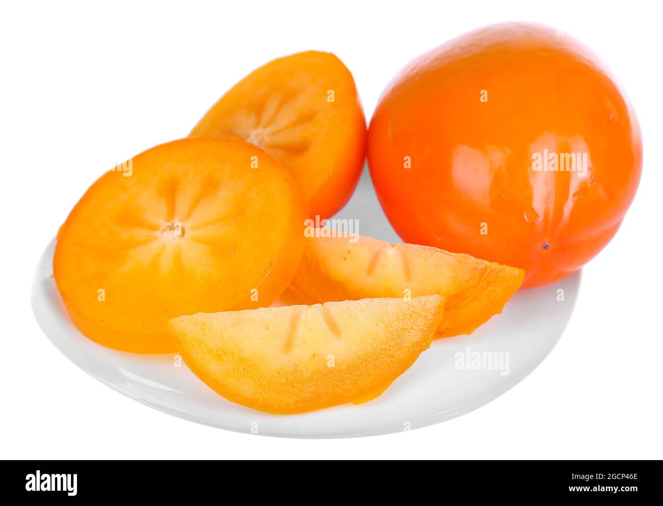 Ripe persimmons on plate isolated on white Stock Photo - Alamy