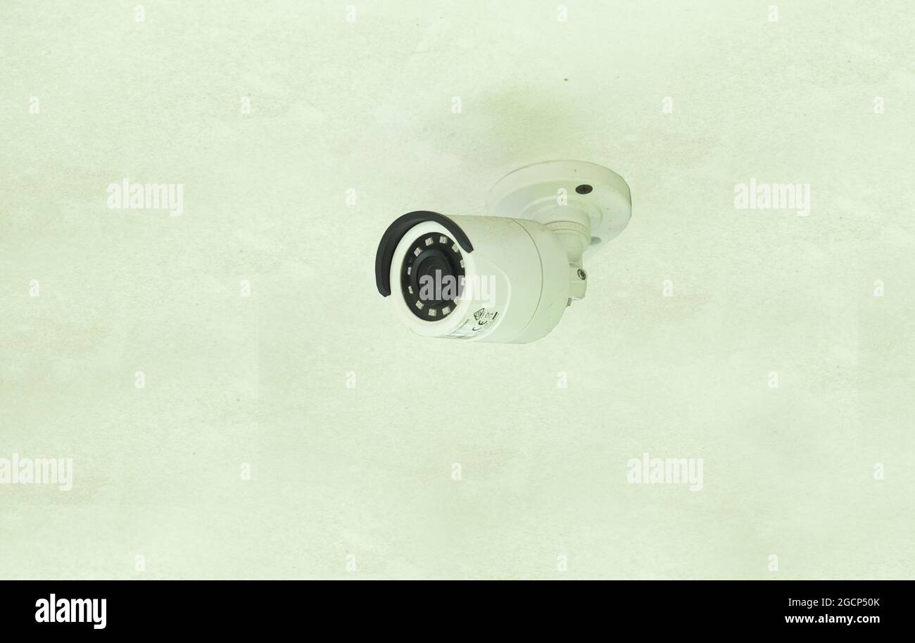 CCTV camera mounted on the ceiling Stock Photo - Alamy