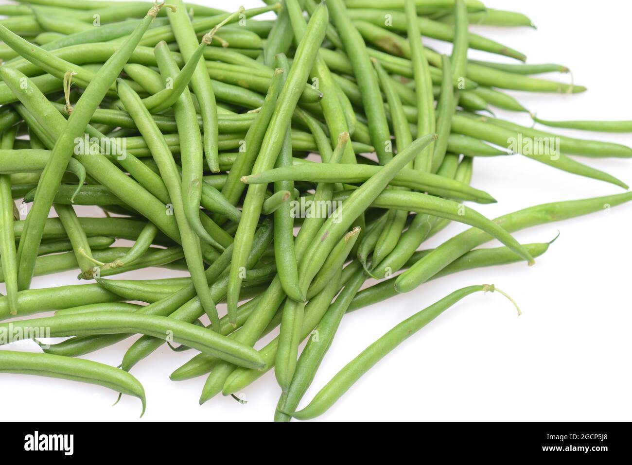 Green string beans on a textured background, empty space for text ...