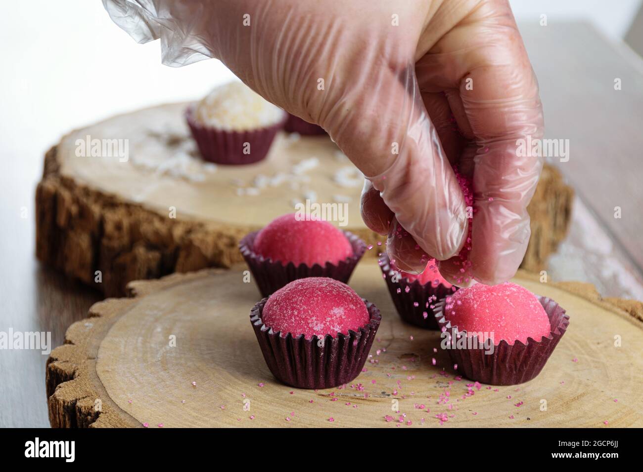 Strawberry Brigadeiros (Bicho de Pe) on tree trunk dishes. Confectioner ...