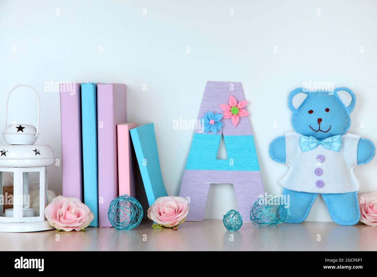 Shelf decorated with handmade knit letter Stock Photo - Alamy
