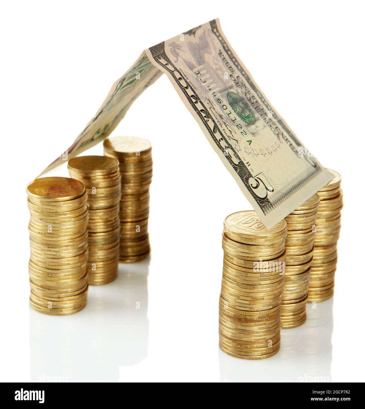 Coins house isolated on white Stock Photo - Alamy