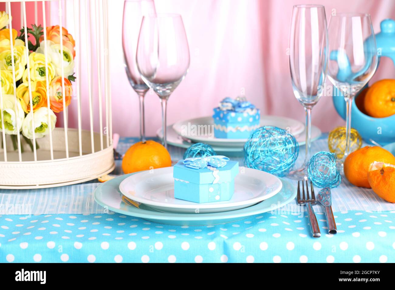 Table serving with colorful tableware on room background Stock Photo ...