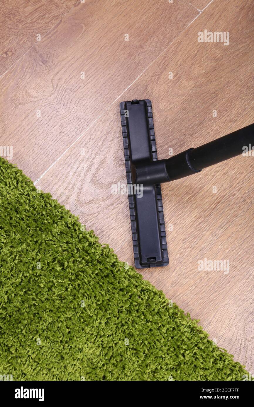Vacuuming carpet in house Stock Photo - Alamy