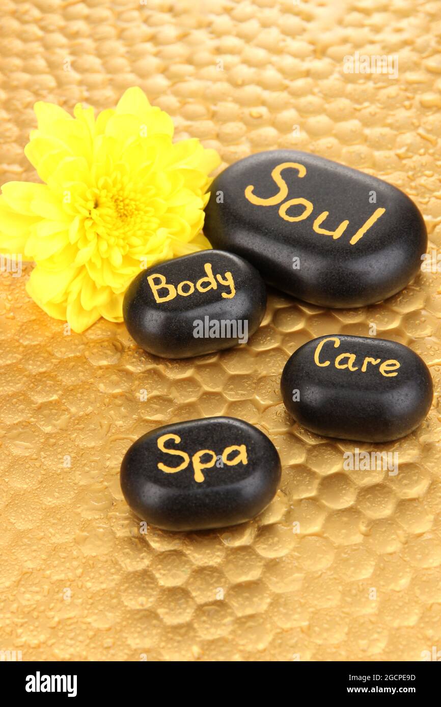 Spa stones on golden background Stock Photo - Alamy
