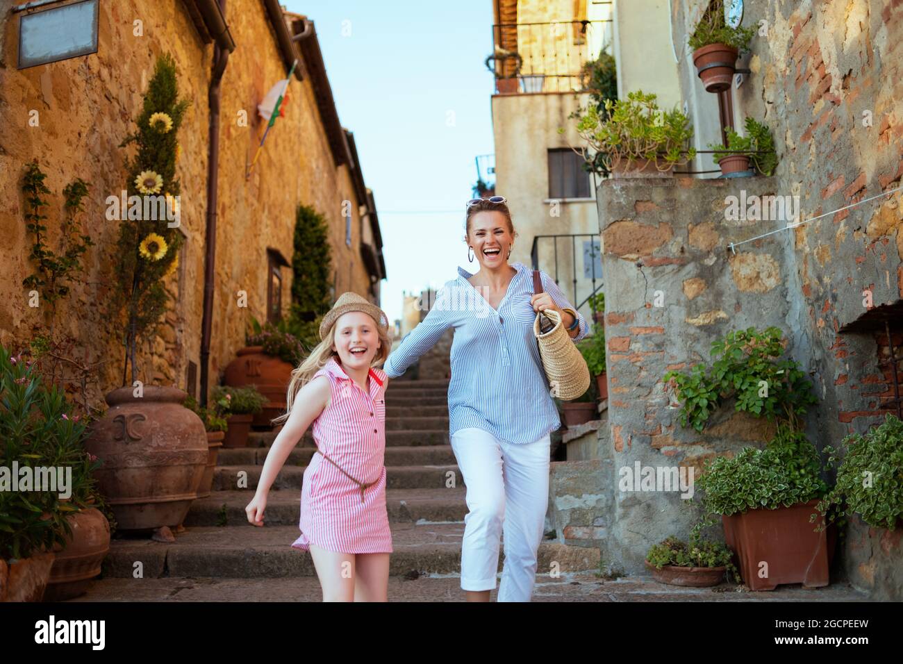 Travel in Italy. happy stylish mother and child tourists in Tuscany ...