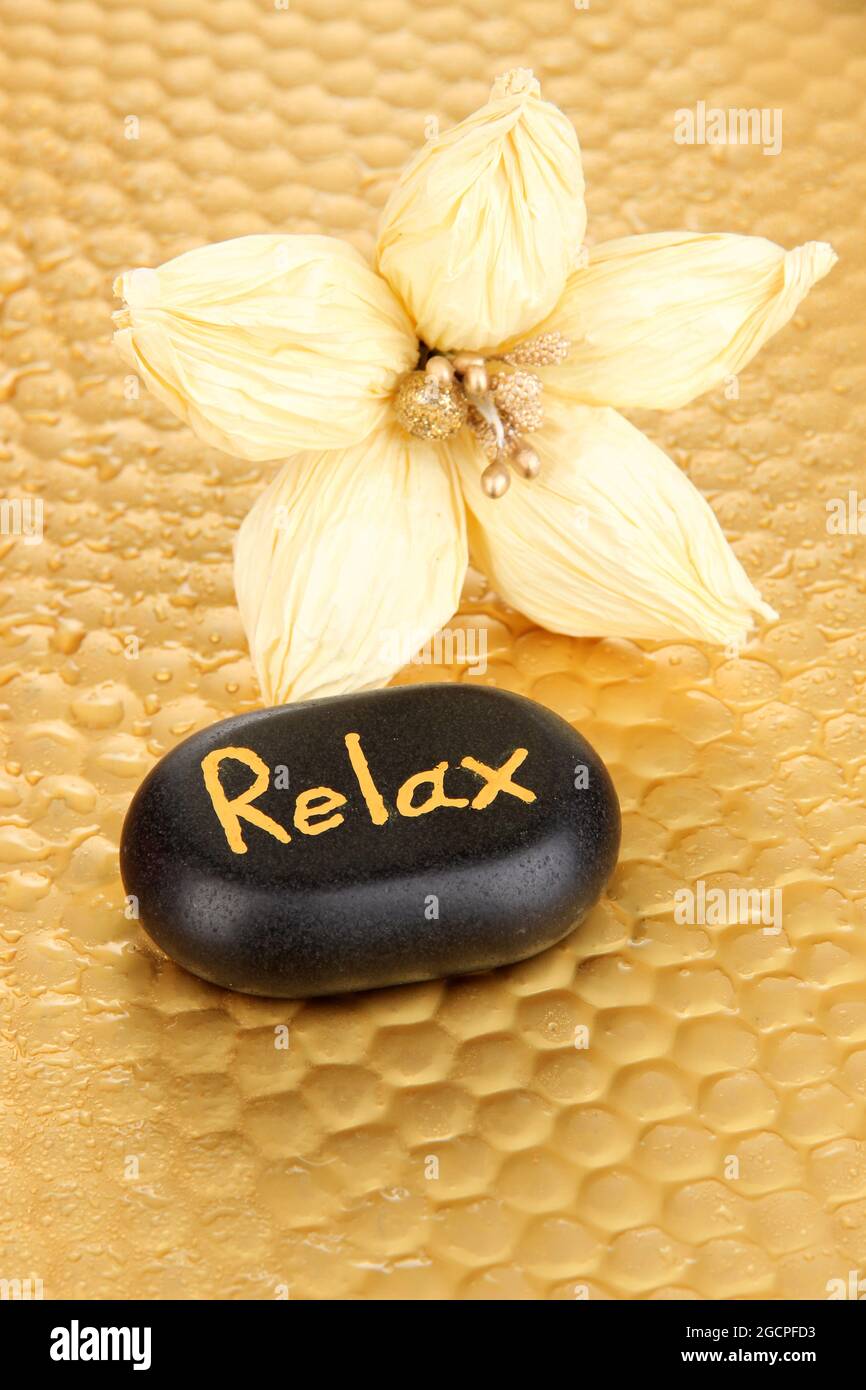 Spa stones on golden background Stock Photo - Alamy