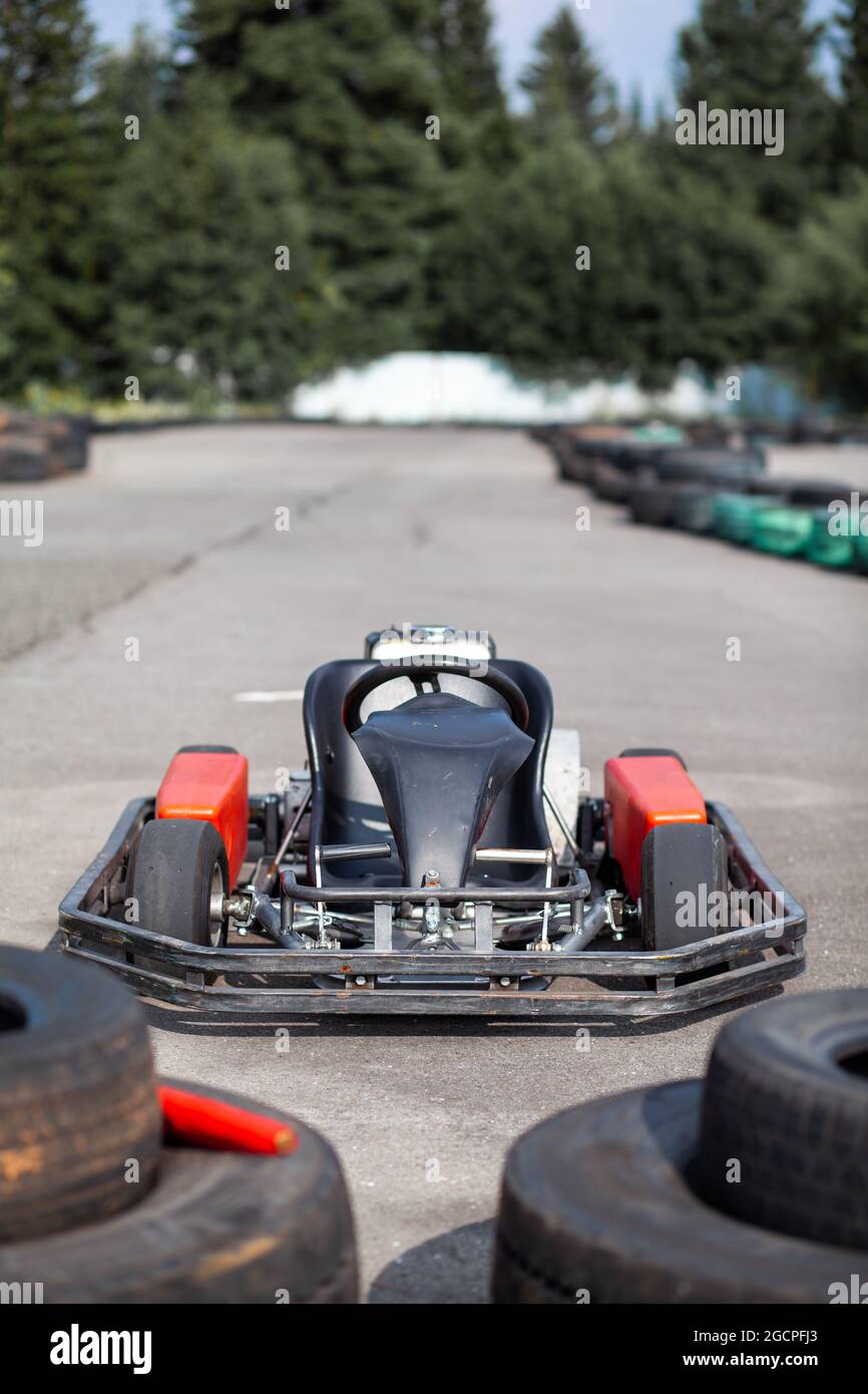 A go-karting car is standing on the highway and waiting for the driver ...