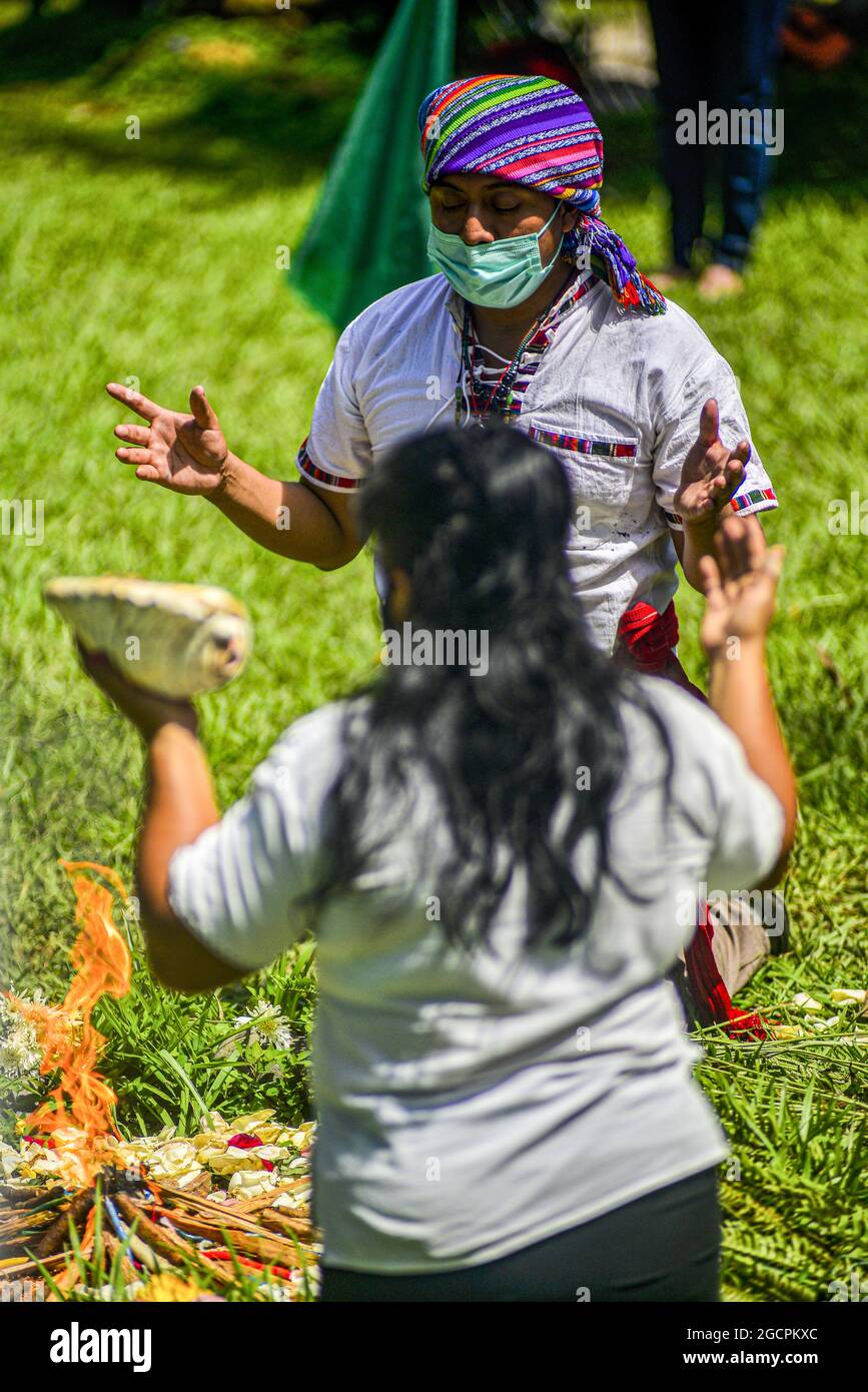 Indigenous people perform a ritual dedicated to nature during the ...