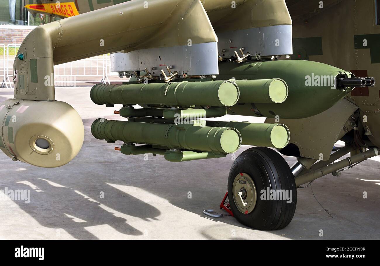 Combat helicopter weapons on the external sling - automatic cannon in ...