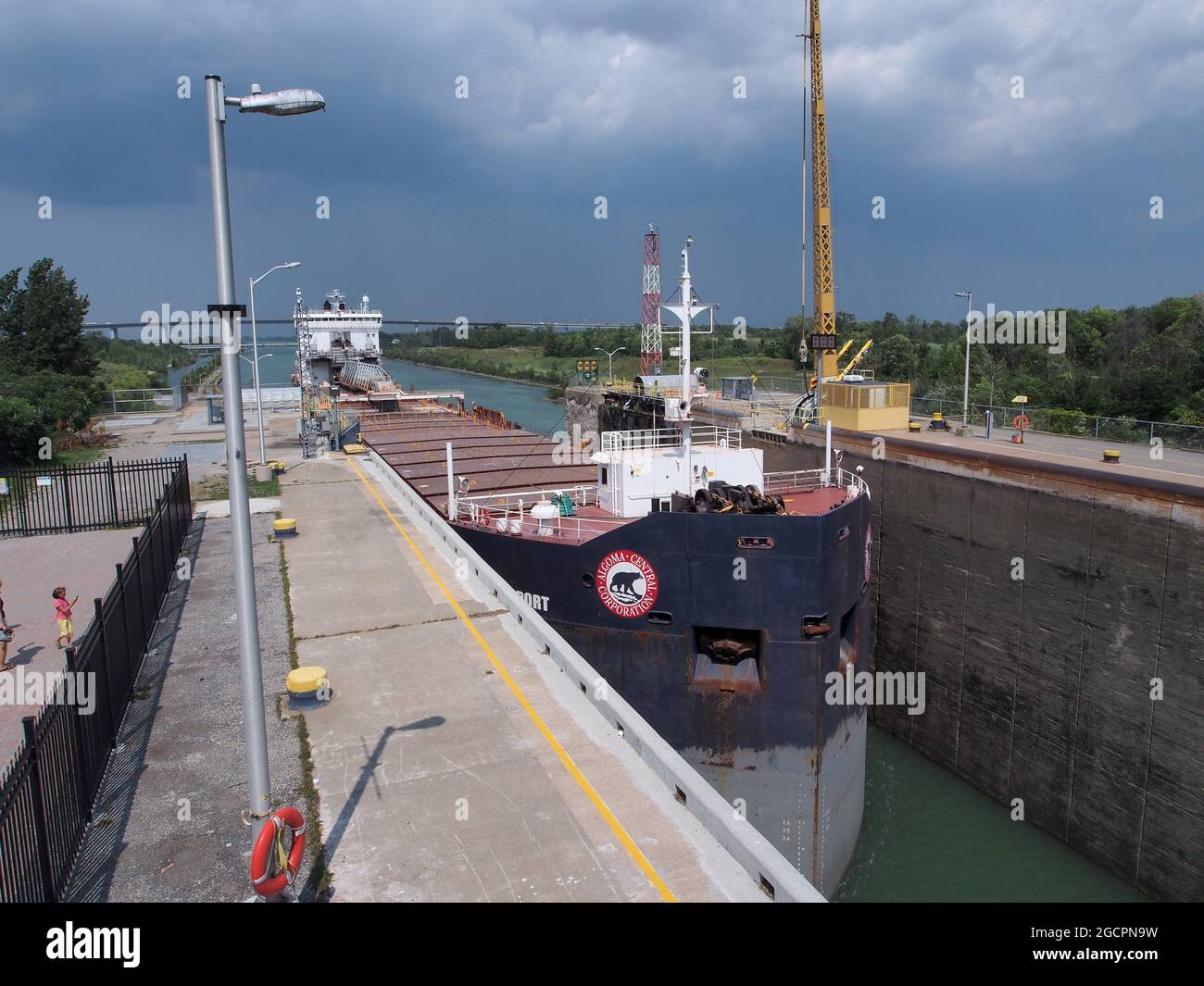 Ontario, Canada - A long, narrow freight ship traverses the Welland ...