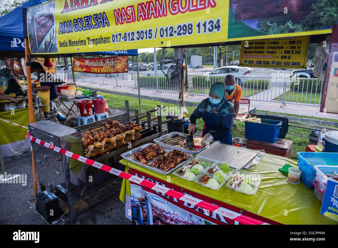 Chicken rice shop in a fresh market. Chicken rice is one of the most ...