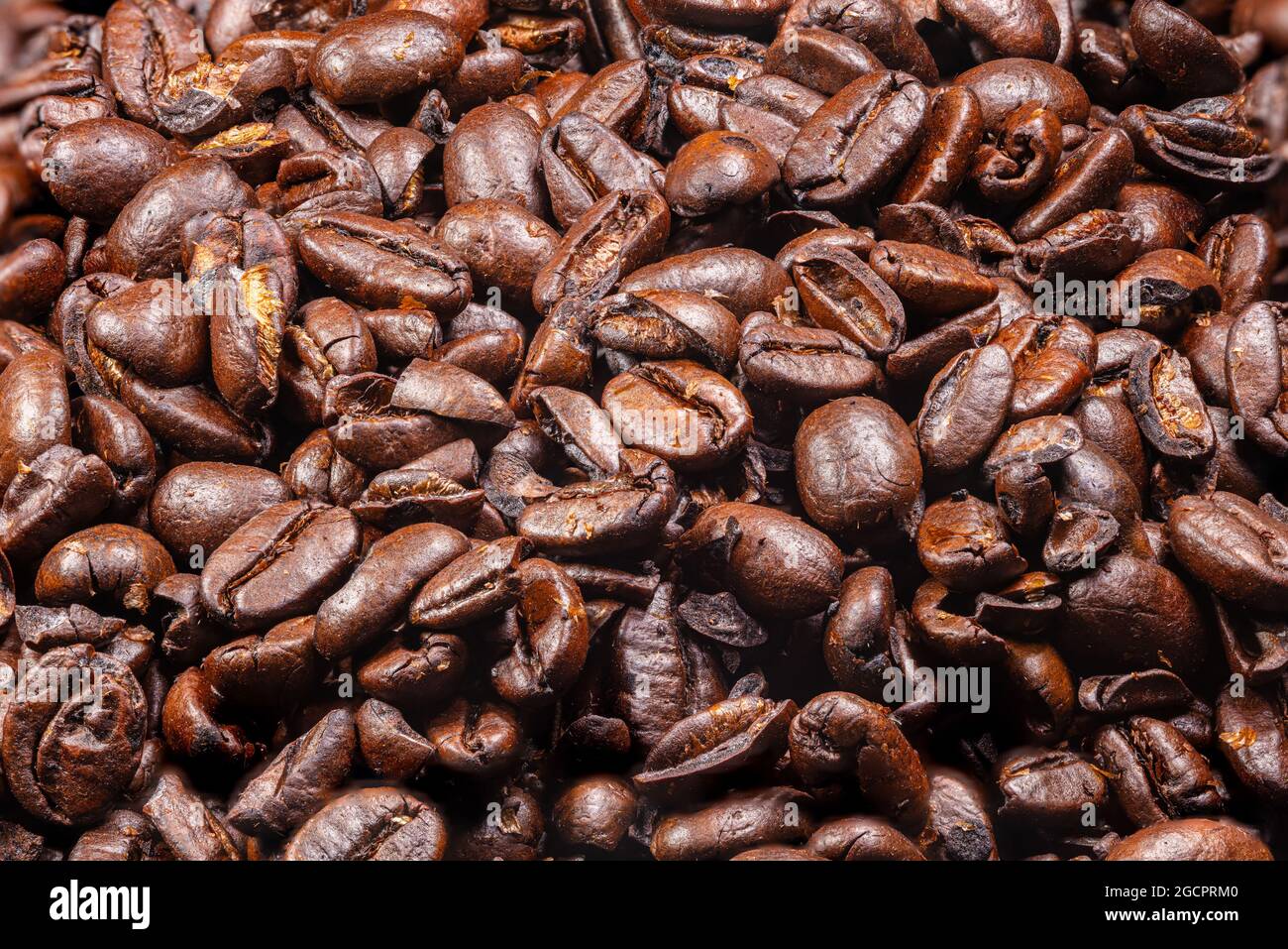 Close up to a heap of coffee beans. Macro photography of fresh roasted ...