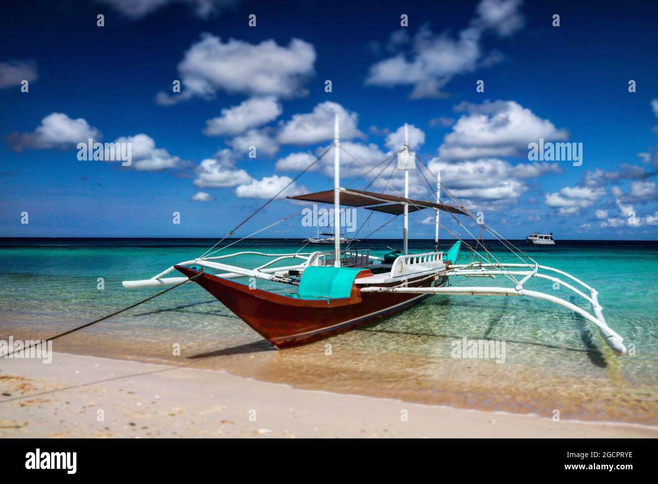 Long tail boat at Lombok island. Boat tour around the Indonesian island ...