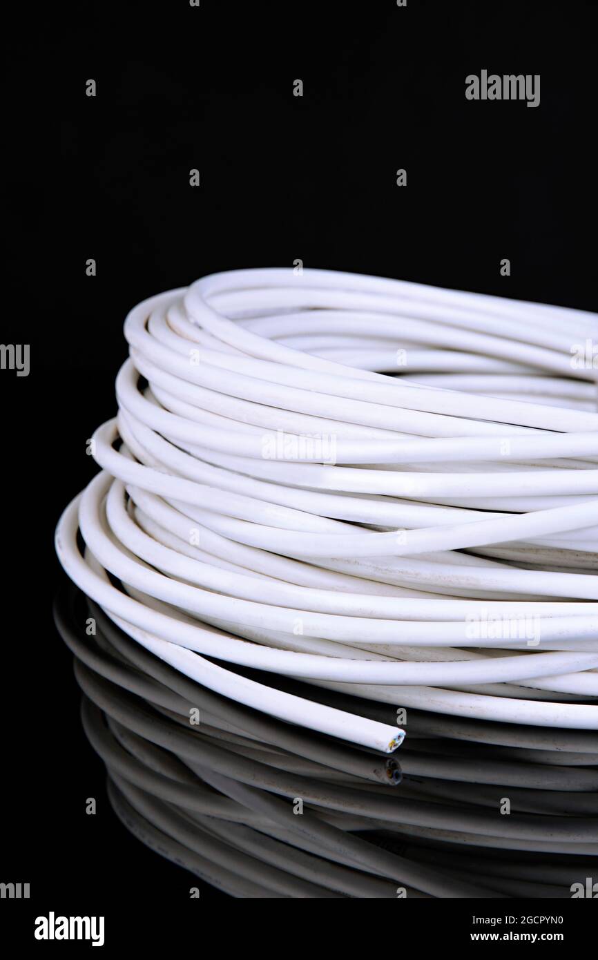 White cable on black background Stock Photo - Alamy