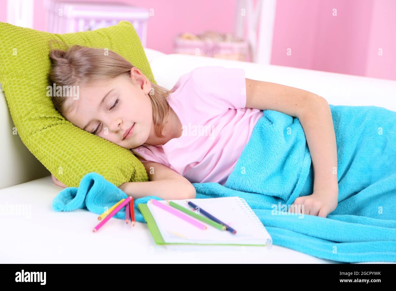 Little girl sleeping on sofa in room Stock Photo - Alamy