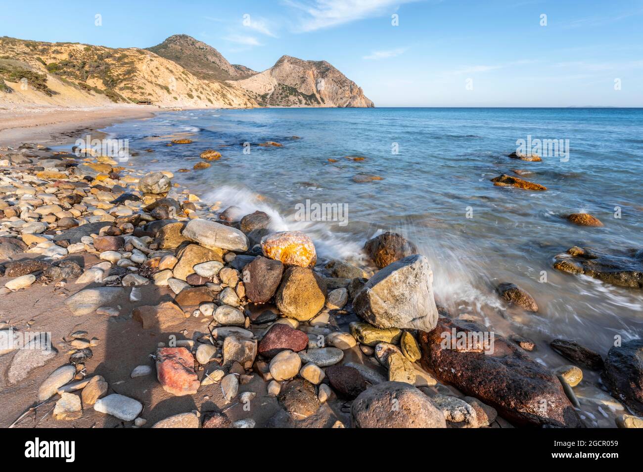 Beach with coloured stones, sandy beach with rocky cliffs, Paralia ...
