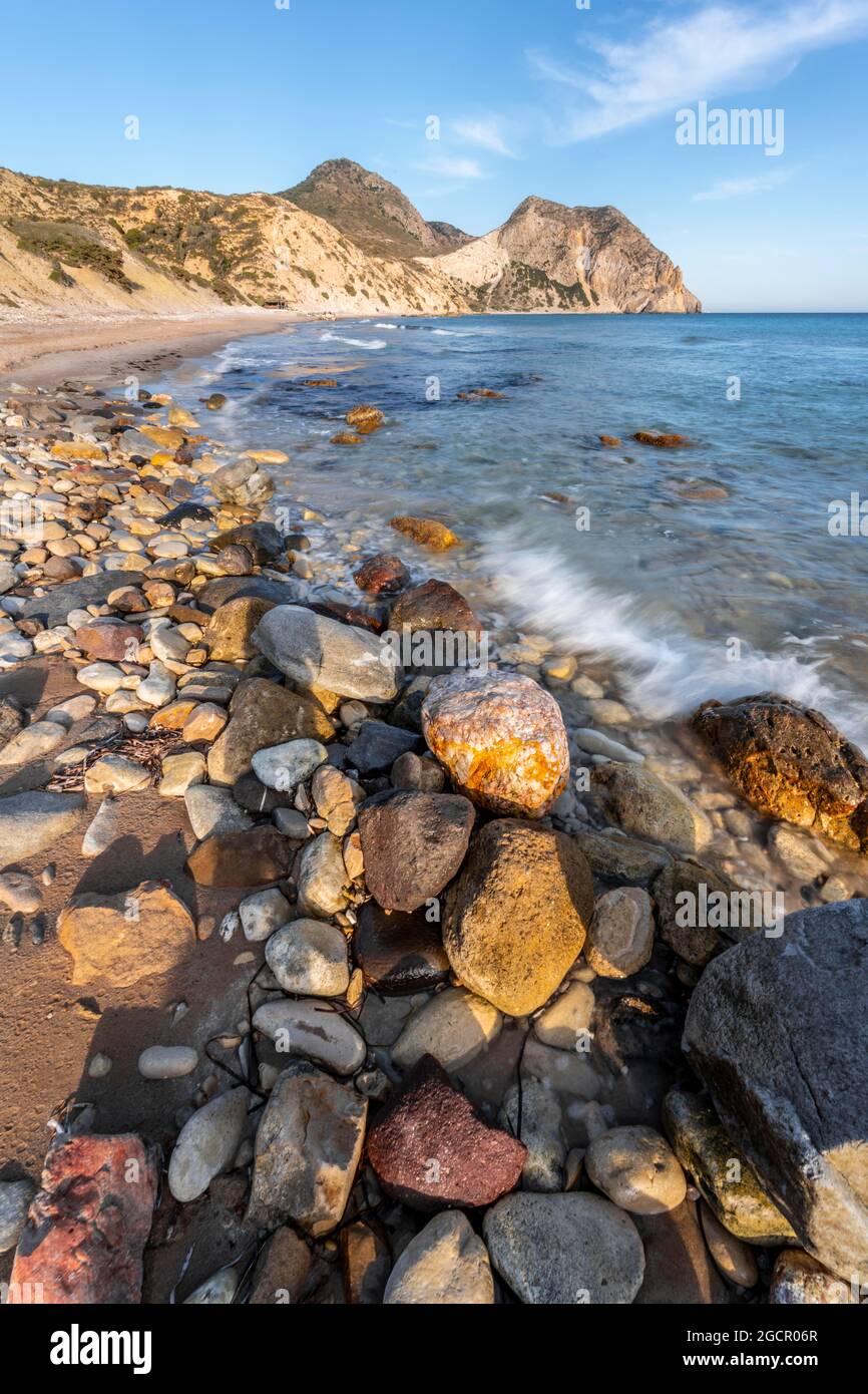 Beach with coloured stones, sandy beach with rocky cliffs, Paralia ...