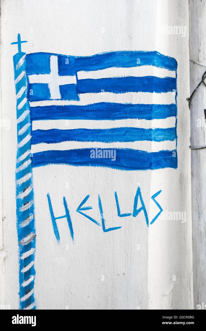 Greek flag painted on a house wall, Lefkes, Paros, Cyclades, Greece ...