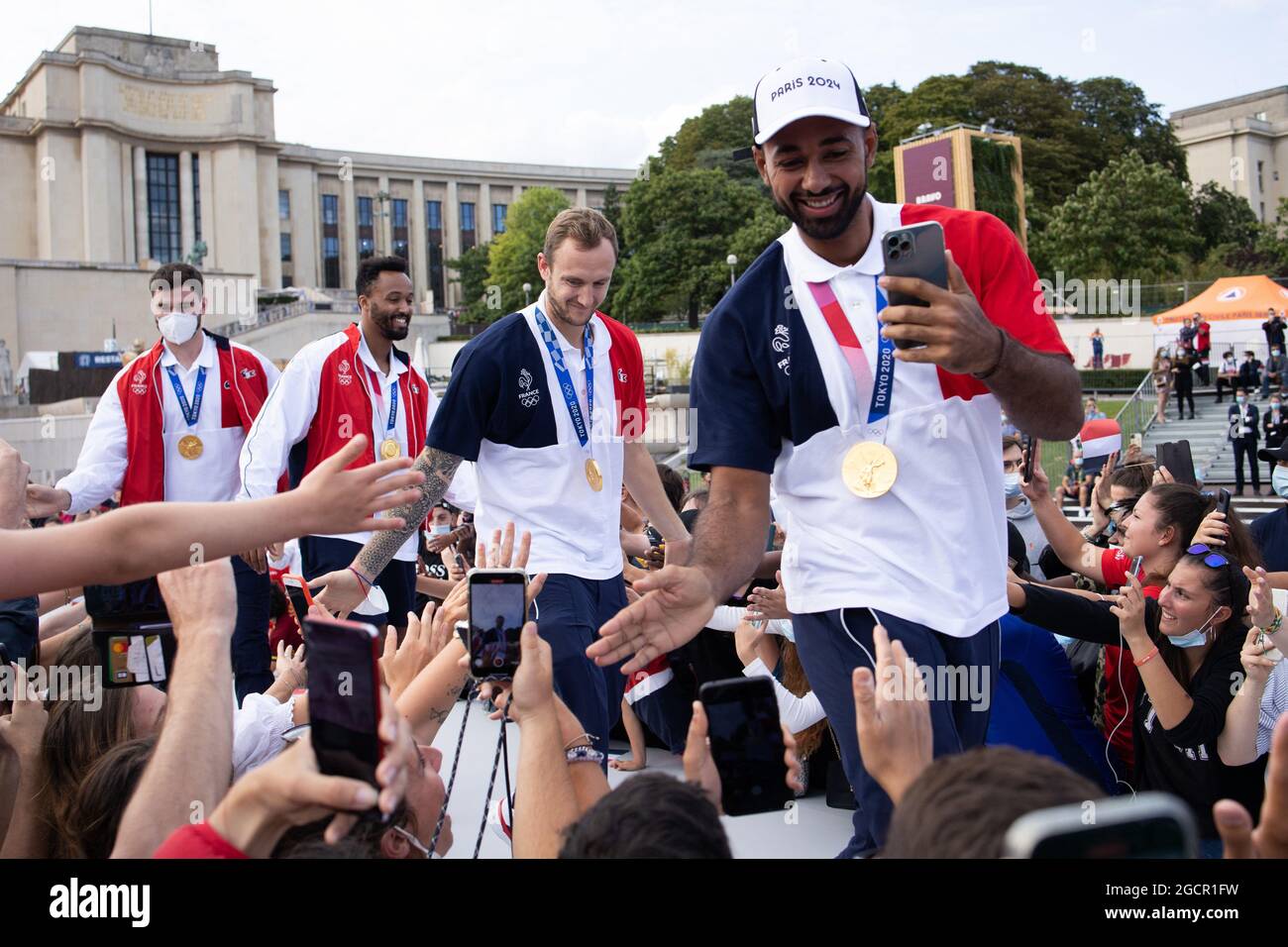 French men hand ball players on stage, in front of the Eiffel Tower on ...