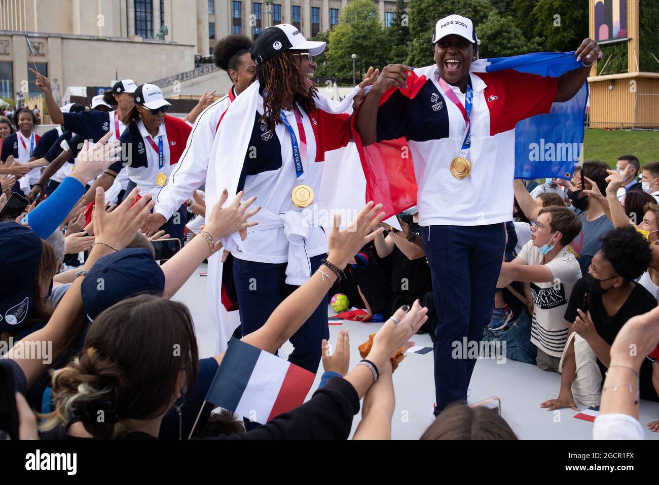 French women hand ball players on stage, in front of the Eiffel Tower ...
