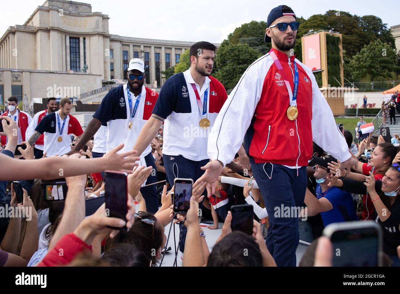 French men hand ball players on stage, in front of the Eiffel Tower on ...