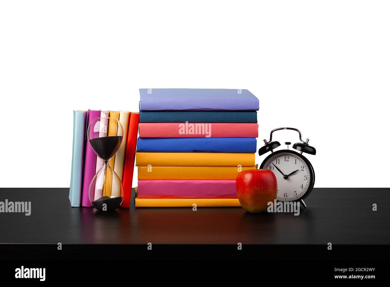 Stack of books and alarm clock, time to read concept Stock Photo - Alamy