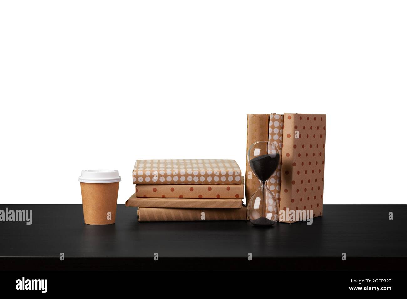 Books on black table against white background Stock Photo - Alamy