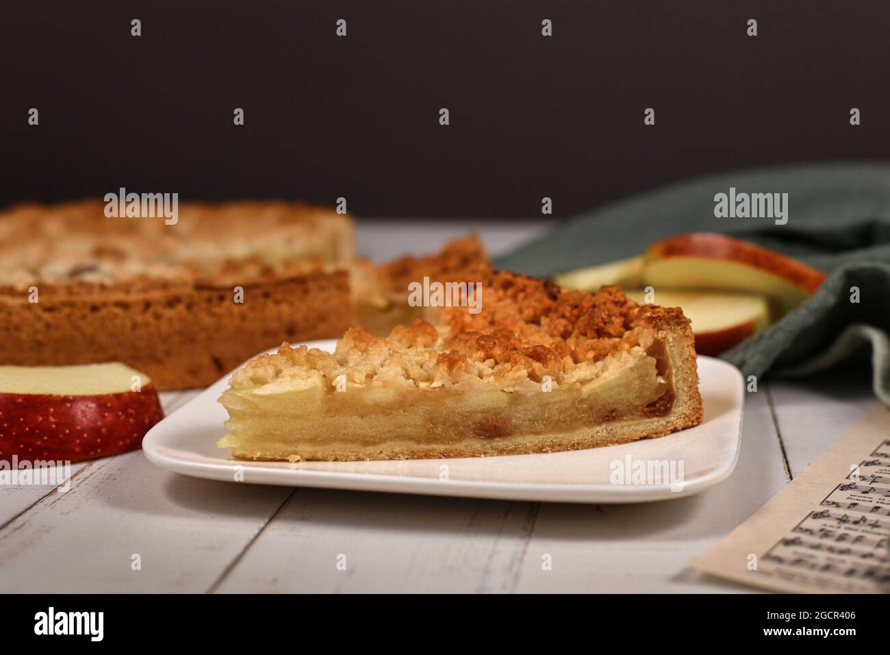 Slice of traditional European apple pie with topping crumbles called ...