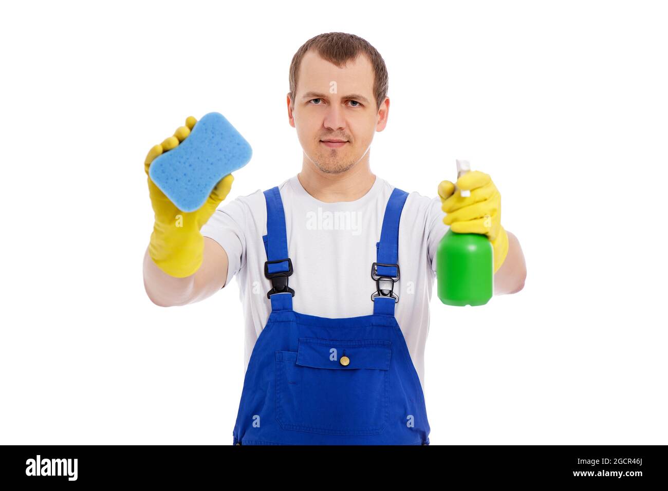 portrait of professional male cleaner in blue uniform cleaning window ...
