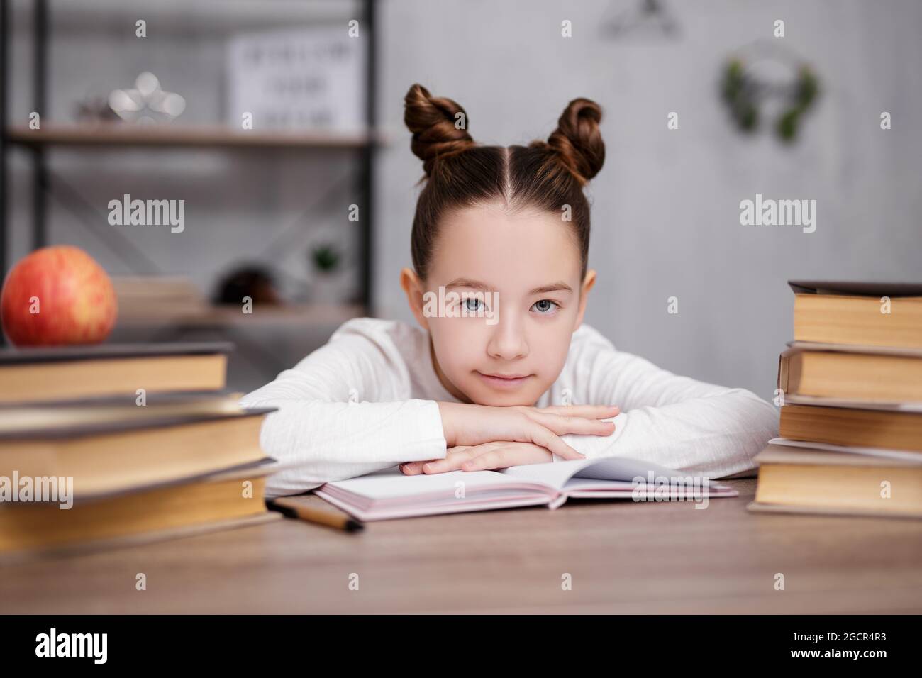school, homework and education concept - cute school girl doing ...