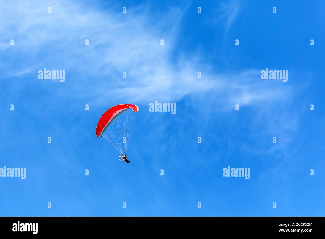 Paramotor flying in a blue sky. Adventure man active extreme sport ...