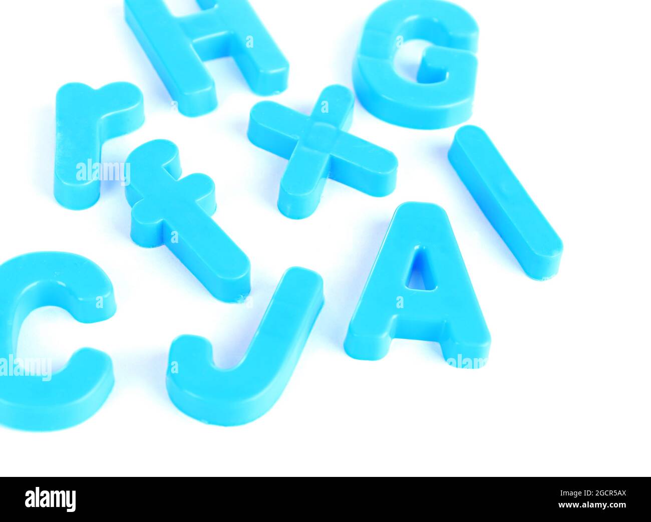 Colorful magnetic letters isolated on white Stock Photo - Alamy