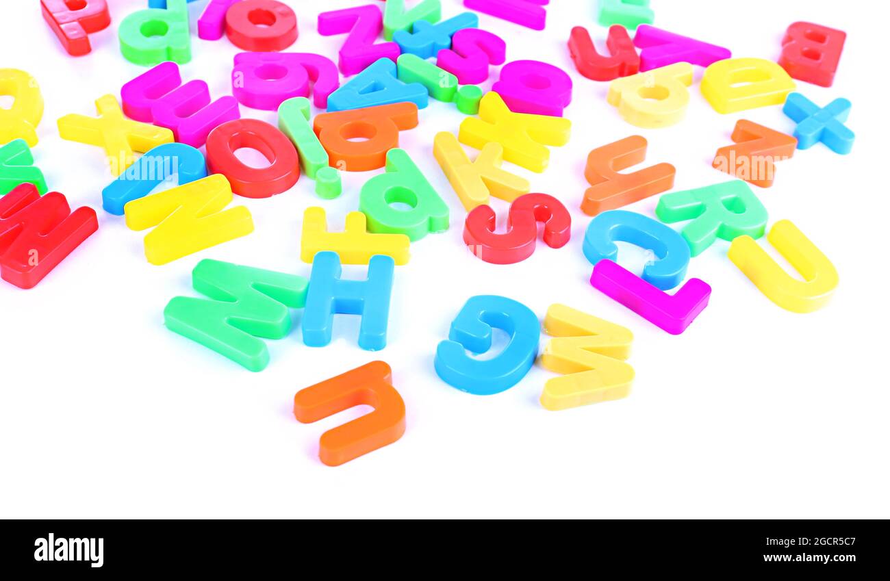 Colorful magnetic letters isolated on white Stock Photo - Alamy