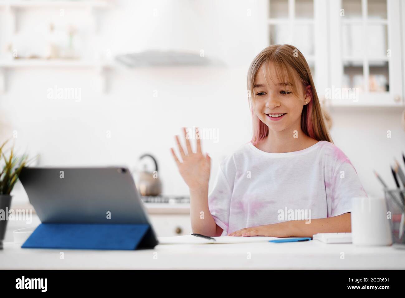 Homeschooled little young girl student having online class using ...