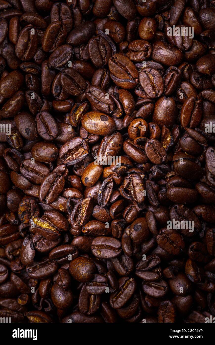 Close up to a heap of coffee beans. Macro photography of fresh roasted coffee beans high ...