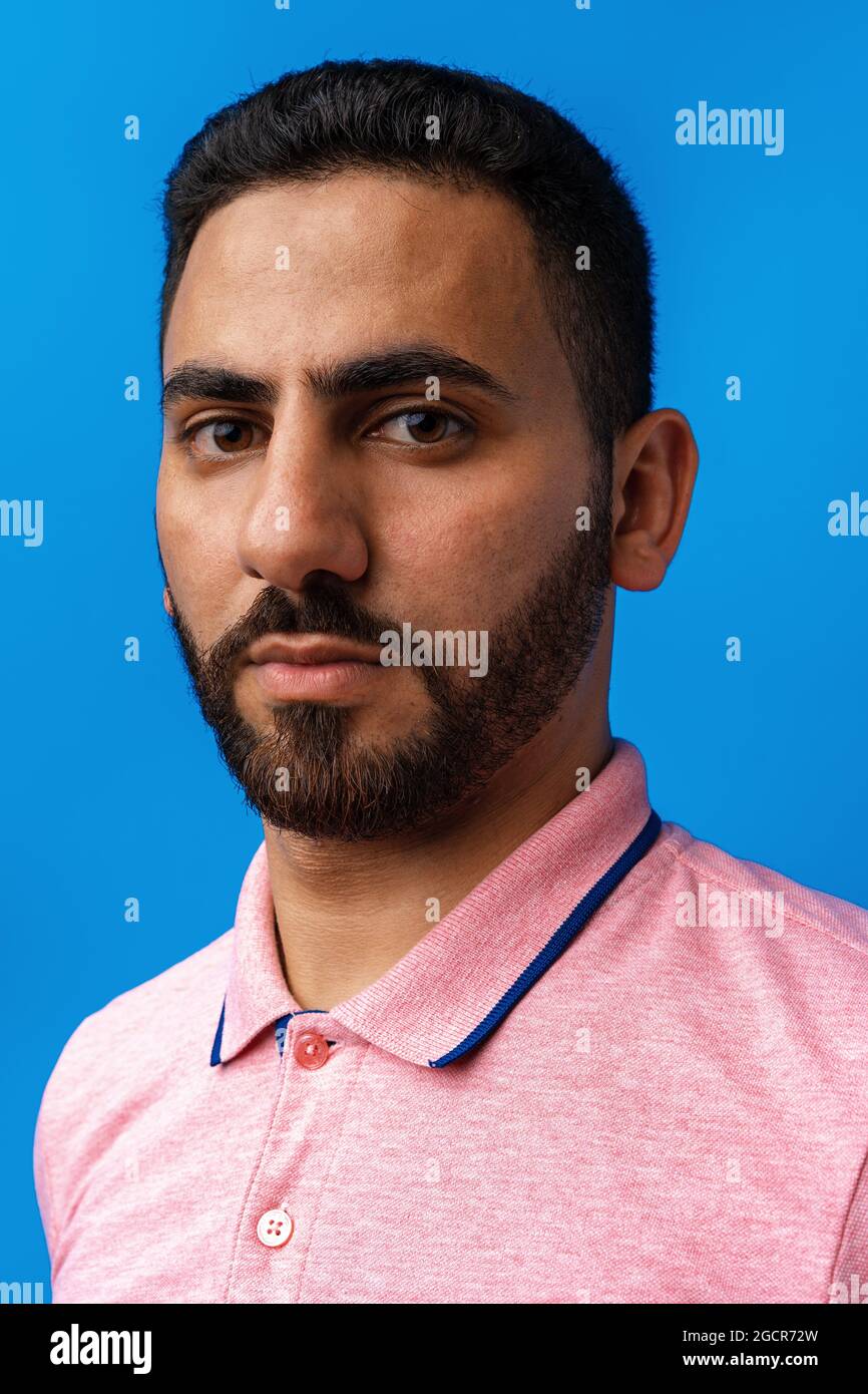 Close up portrait of young arab man in studio Stock Photo - Alamy