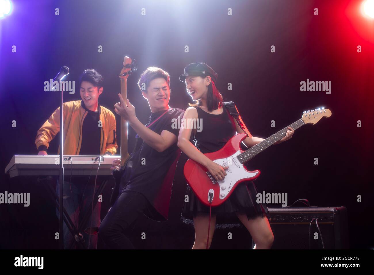 Young musical band on stage Stock Photo - Alamy