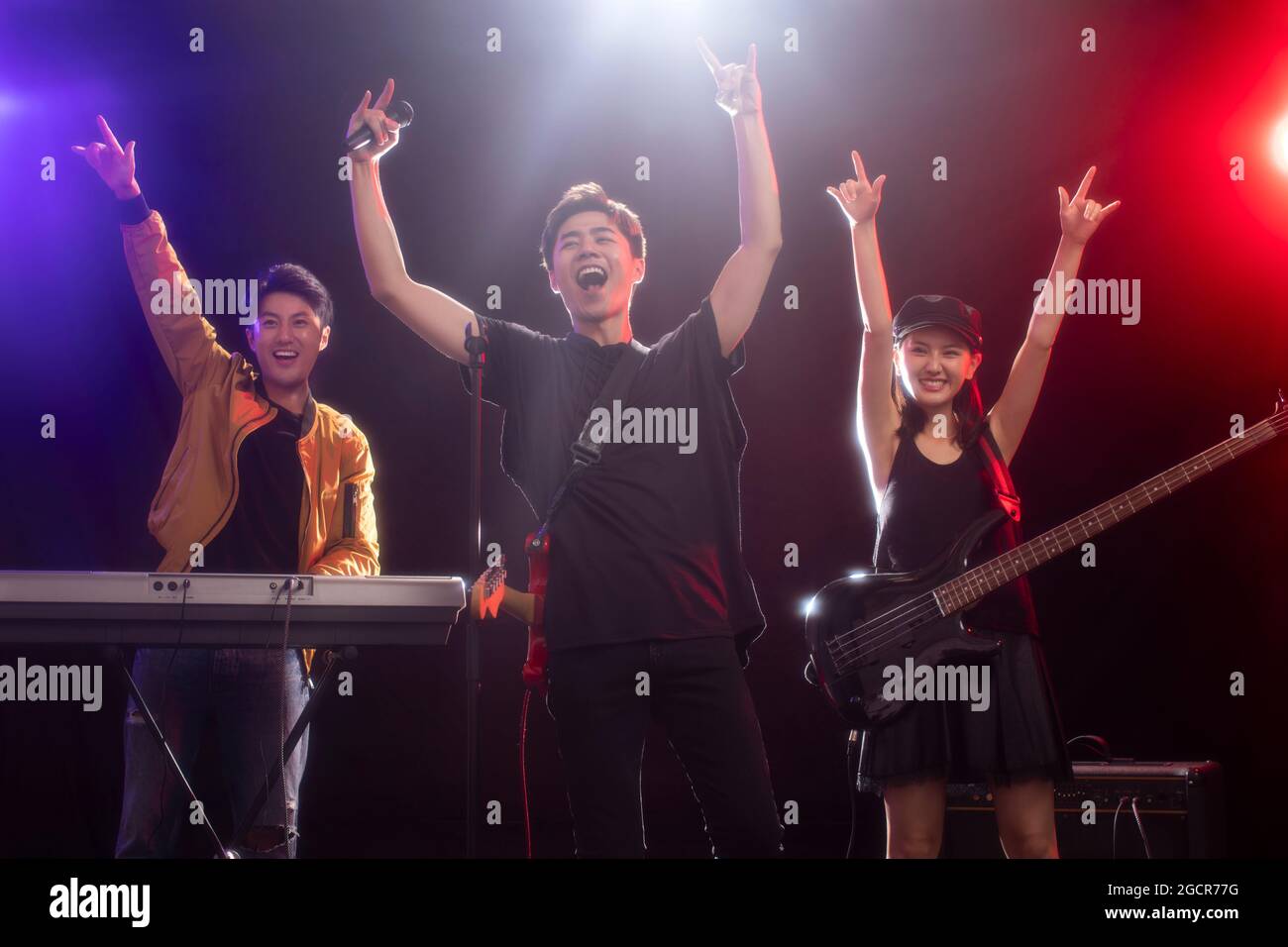 Young musical band on stage Stock Photo - Alamy
